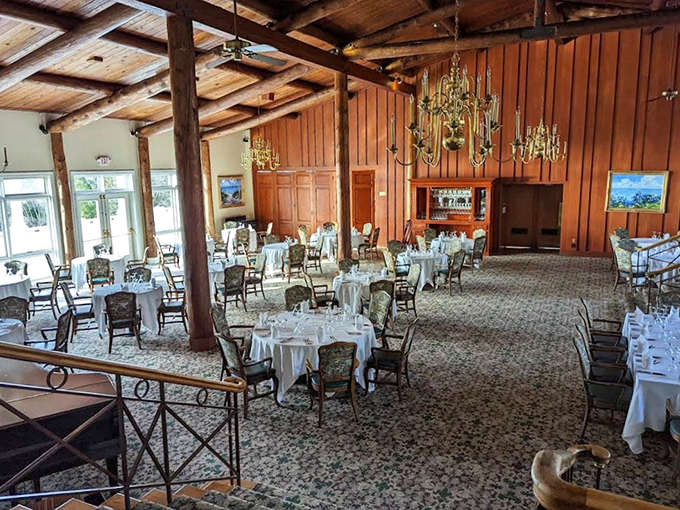 An elegant dining room with exposed beams and white tablecloths, where meals feel like special occasions even when you're just really hungry.