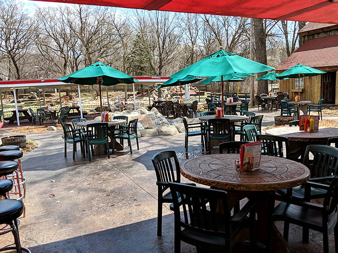 The outdoor dining area invites you to linger under turquoise umbrellas, where conversations flow as freely as the homemade root beer.