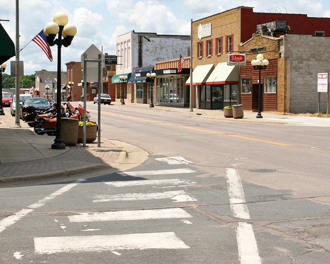Pedestrian-friendly sidewalks and classic storefronts create an atmosphere where window shopping becomes an afternoon's delightful entertainment.