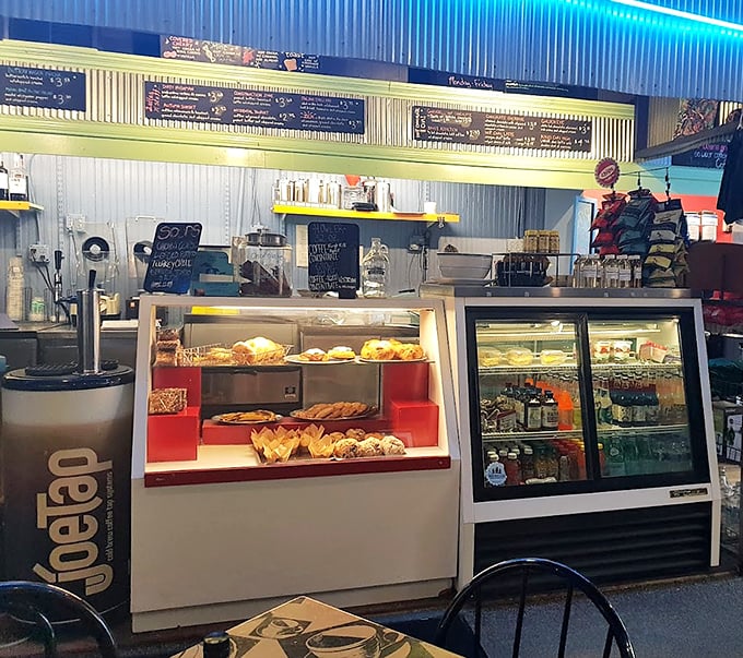 Food Display Case: A glass-fronted gallery of temptation where pastries pose prettily, making decision-making the day's first delicious challenge.