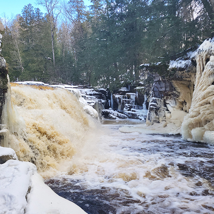 Winter transforms Canyon Falls into a frozen fantasy world where water pauses mid-plunge, defying gravity and expectations.