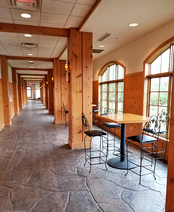 Warm wooden beams line the corridor, creating a cozy alpine atmosphere that contrasts beautifully with the aquatic adventures just steps away.
