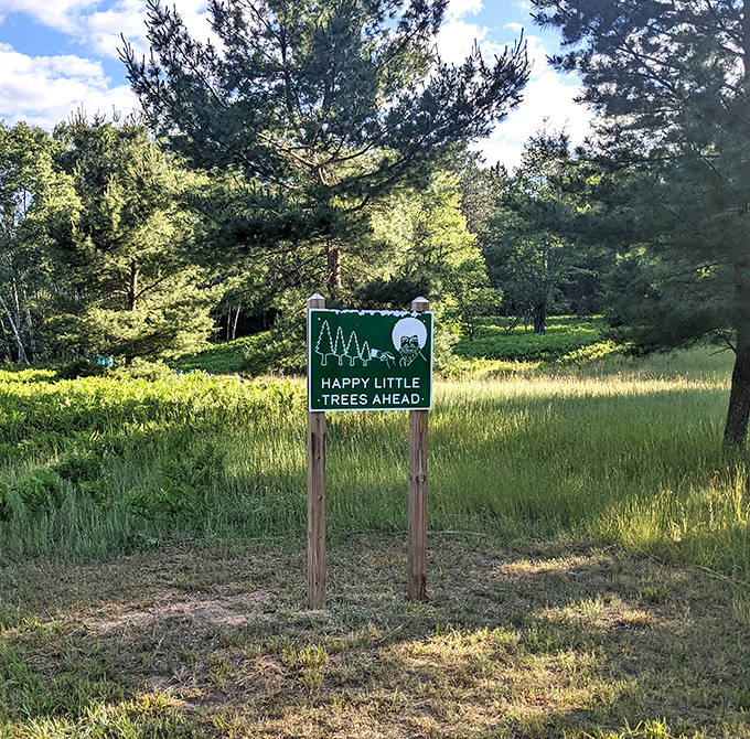 Bob Ross would approve of this whimsical sign marking Michigan's reforestation efforts &ndash; where prison-grown seedlings become tomorrow's forest giants.