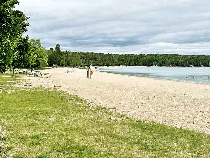 White sand stretches toward the horizon, inviting bare feet and the special kind of nap that only happens at the beach.