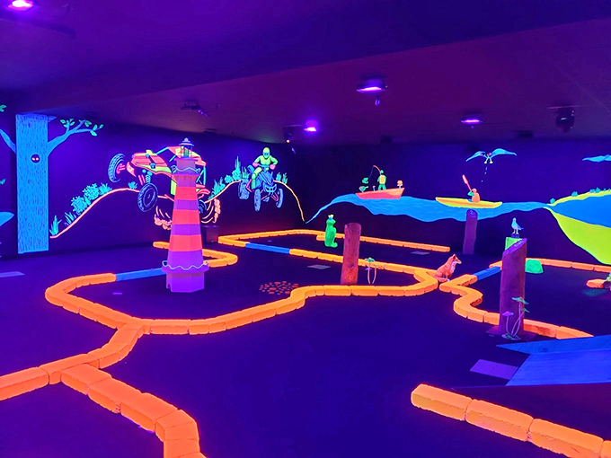 Glowing pathways guide putters through a neon forest where every obstacle tells a story of outdoor adventure.