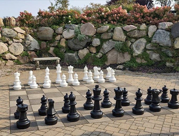 Giant chess pieces await strategic minds, where moving a knight requires both brain power and actual physical power.