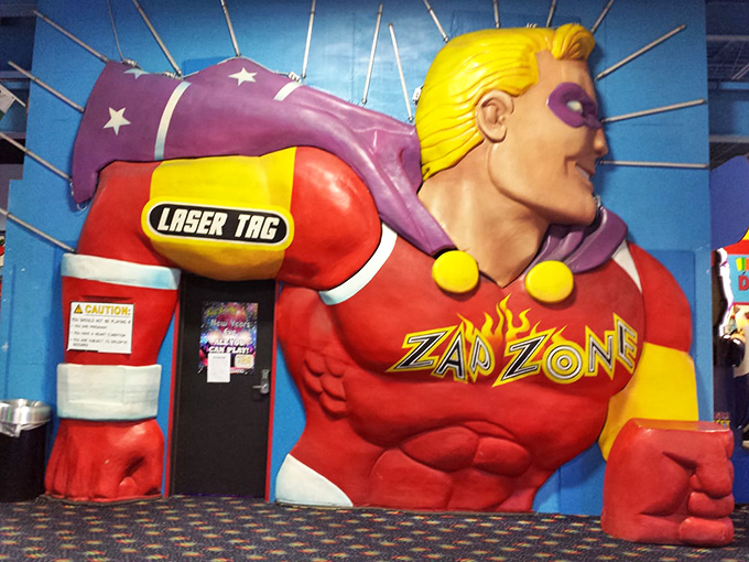 The superhero-themed laser tag entrance stands guard, silently judging whether you're worthy of wielding its high-tech phaser weaponry.
