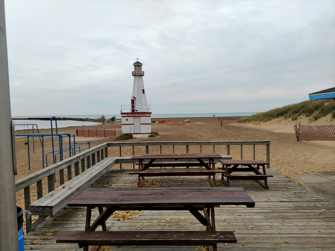 New Buffalo's lighthouse stands sentinel at the harbor, a red and white exclamation point against the blue canvas of Lake Michigan.