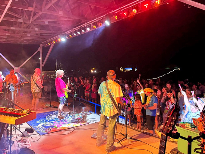 As night falls, the concert stage lights up with island rhythms, transforming Caseville into Michigan's answer to Margaritaville.