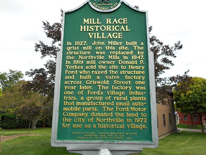 The historical marker tells Mill Race Village's story in brief, though the real tales lie in the worn thresholds and weathered clapboards beyond.