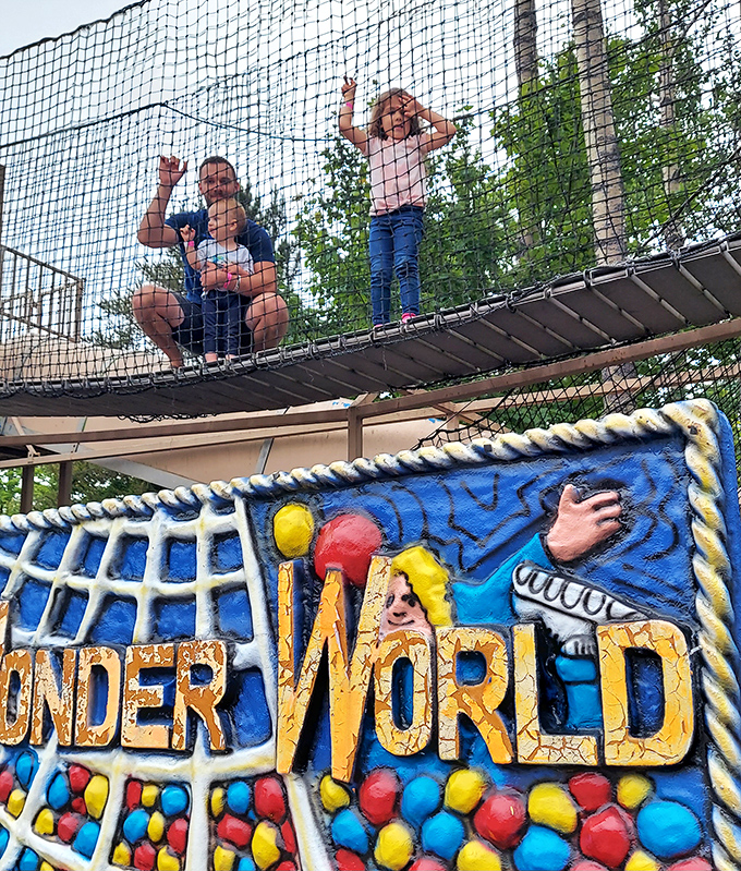 The "Under World" netted bridge lets kids burn energy while parents take a much-needed breather. Pediatricians approve this kind of play that many modern venues have engineered away.