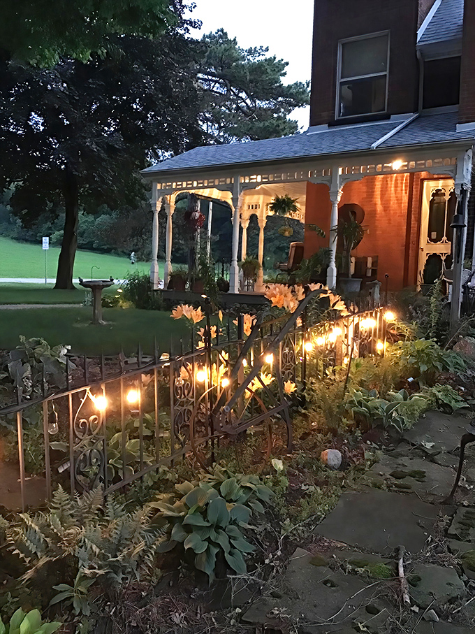 Night View: As darkness falls, the illuminated porch glows like a Victorian lighthouse, guiding guests home with warmth and nostalgic charm.