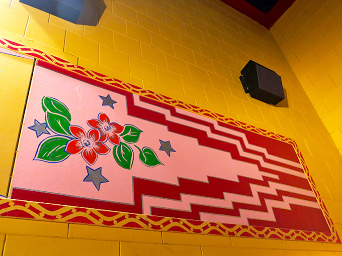 Hand-painted details bloom on the walls, flowers and stars creating a garden of visual delights that honor the theater's name.