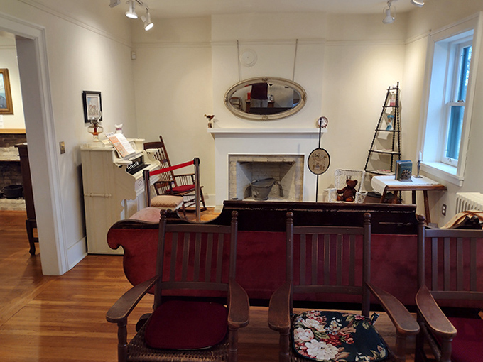 Vintage furniture and period details in the parlor room transport visitors to the early days of lighthouse keeping.