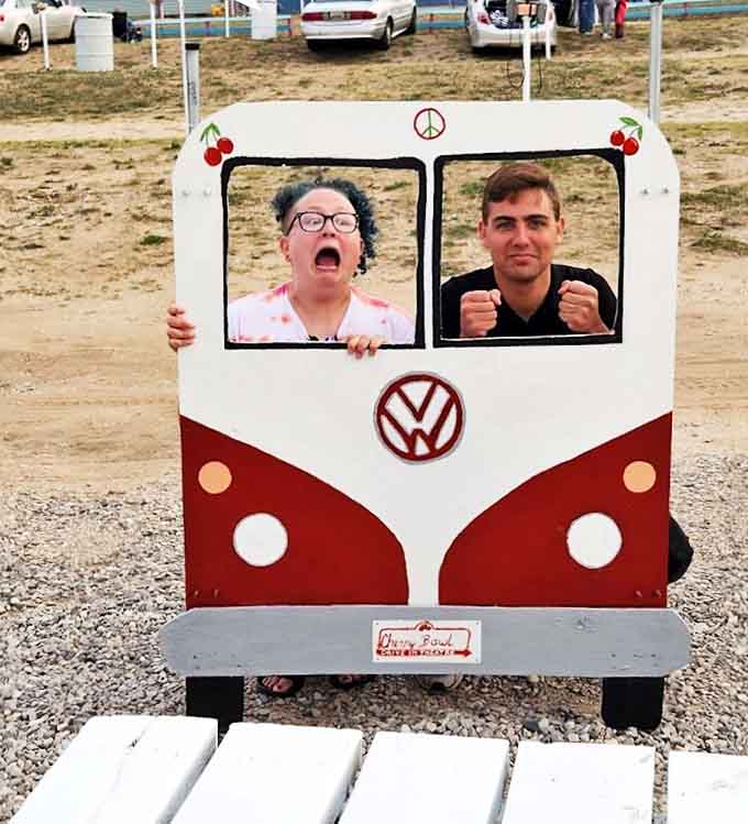 The VW bus photo-op frame captures smiles and silly faces. Some memories need physical evidence to be believed later.