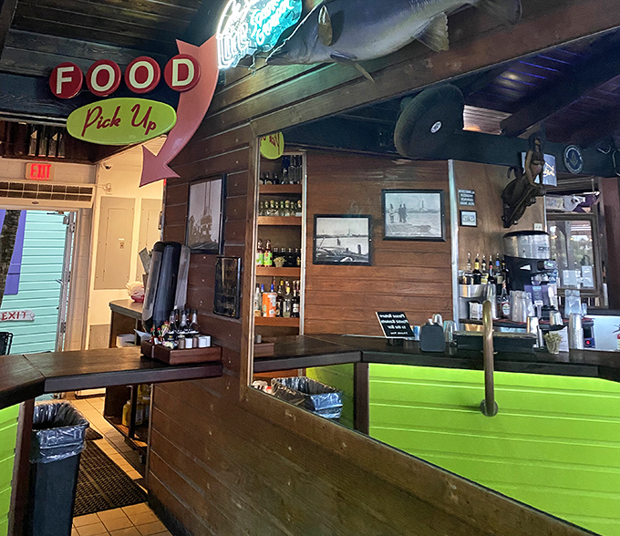 The "Food Pick Up" sign points the way to happiness, while the wooden interior whispers tales of countless perfect Florida afternoons.