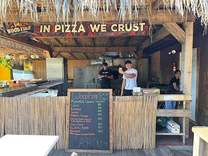 "In Pizza We Crust" declares this wood-fired pizza stand, where hungry shoppers refuel with hand-crafted pies between treasure hunts.