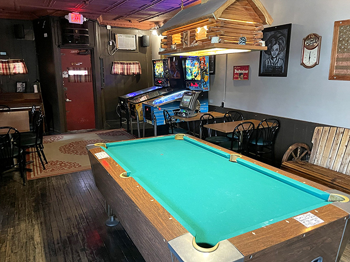 The pool table area beckons with promises of friendly competition, while regulars whisper about balls that occasionally move on their own.
