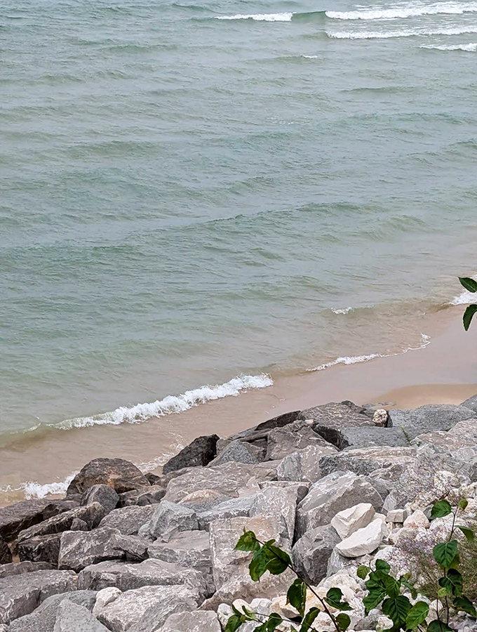 Nature's breakwater: these ancient rocks have been standing guard against Lake Michigan's moods since before selfies were invented.