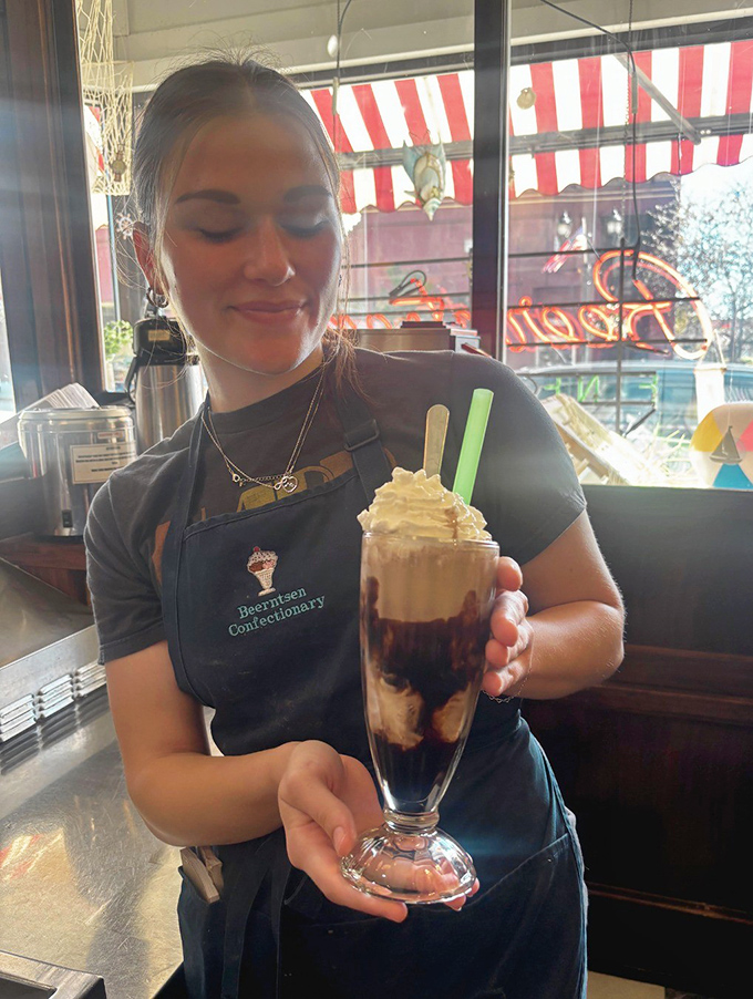 Presenting a perfect ice cream creation with the pride of an artist – because when you work at Beerntsen's, you're not just serving food, you're delivering memories.