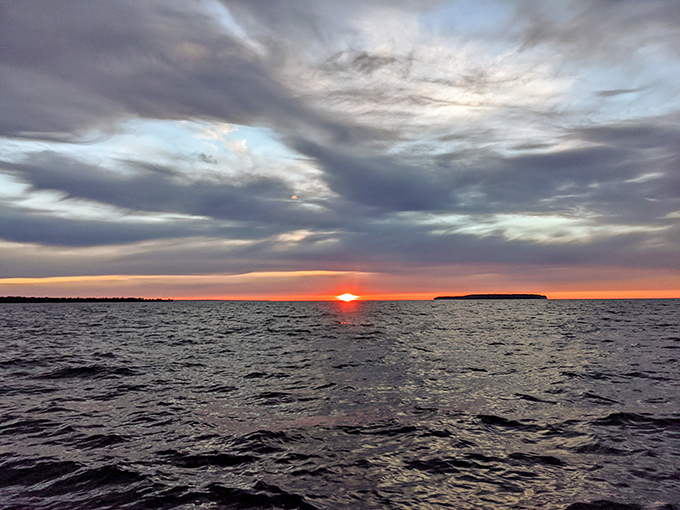 The sun calling it a day, painting the sky in colors that make even the Pictured Rocks jealous.