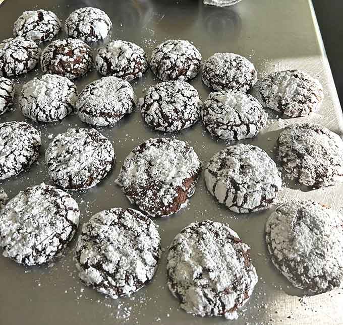 Chocolate crinkles with that perfect contrast between powdered sugar coating and fudgy interior, like edible works of abstract art.