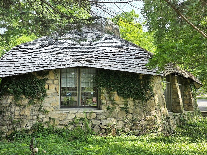 Ivy embraces this circular stone cottage, enhancing its organic quality as nature reclaims what was inspired by her in the first place.