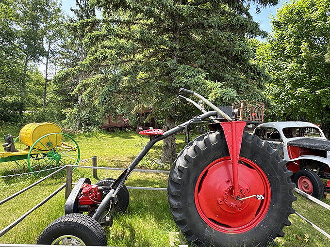 This modified farm equipment with its massive red wheel demonstrates the engineering creativity that thrives in Michigan's northernmost region.