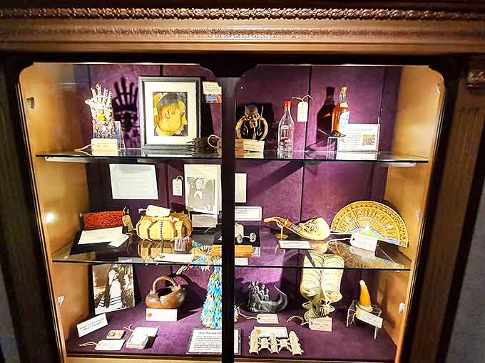 A cabinet of cultural curiosities houses artifacts that tell stories of traditions and beliefs from around the world.
