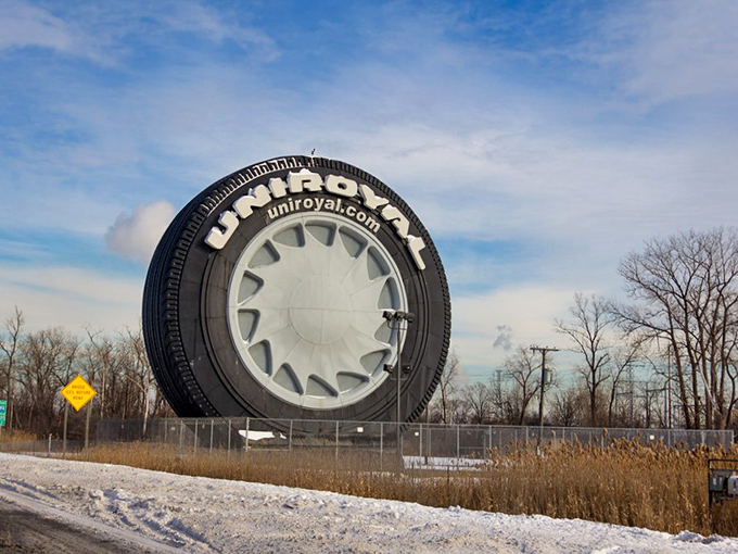 Winter adds a dusting of snow to the world's largest tire, creating a uniquely Michigan postcard moment.