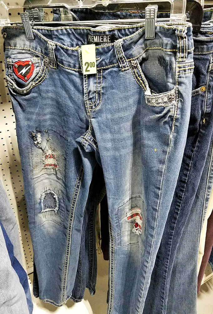 Designer jeans at thrift store prices &ndash; the holy grail of secondhand shopping. These distressed denim treasures with decorative pockets await their next adventure.