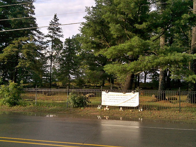 The simple black fence marks a boundary between worlds &ndash; step through and feel the shift in atmosphere.