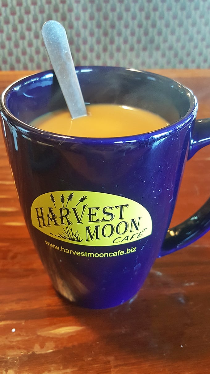 That deep blue mug isn't just holding coffee &ndash; it's cradling liquid motivation in ceramic form, ready to fuel your Michigan adventures.