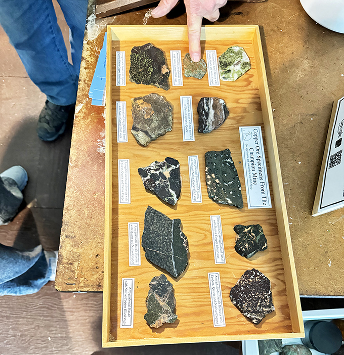 This collection of copper ore specimens showcases the reason for Champion Mine's existence – the rich, distinctive minerals that fueled America's industrial growth.