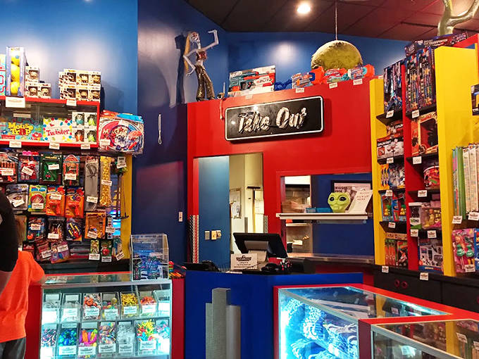 The "Take Out" counter isn't just functional &ndash; it's part of the immersive experience, surrounded by alien memorabilia and cosmic curiosities.