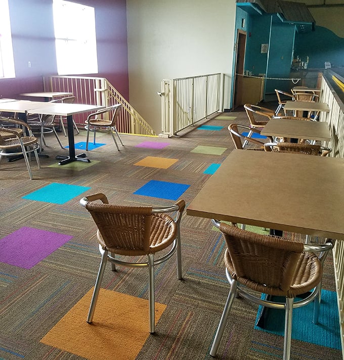 The dining area provides the perfect vantage point for parents to refuel while maintaining visual contact with water-loving offspring.