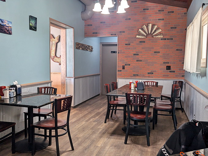 A cozy dining area where strangers become friends over shared meals and local stories &ndash; the essence of small-town charm.