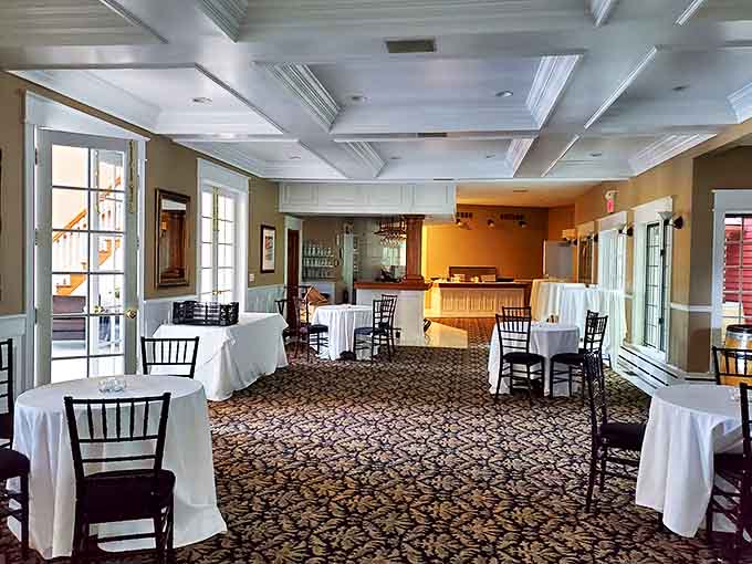 Elegant simplicity defines the dining space, where white tablecloths and coffered ceilings create the perfect setting for memorable meals and conversations.