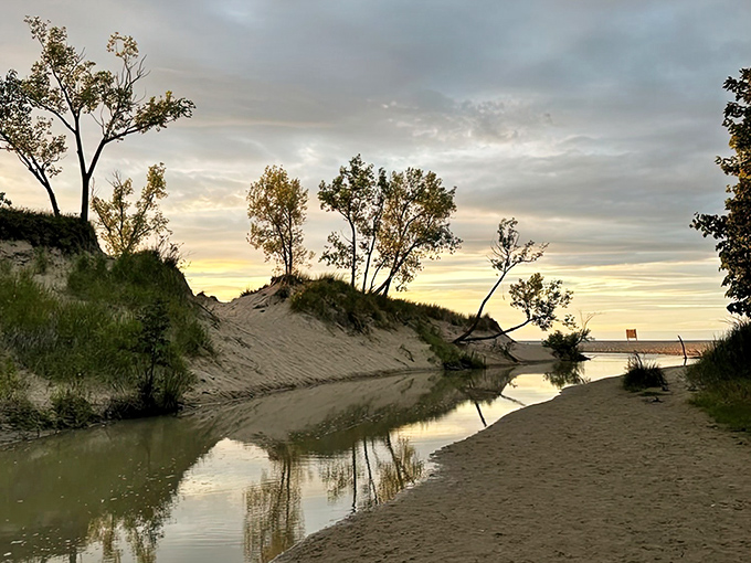 Where dunes meet water in perfect harmony, creating reflections that mirror nature's undisturbed beauty.