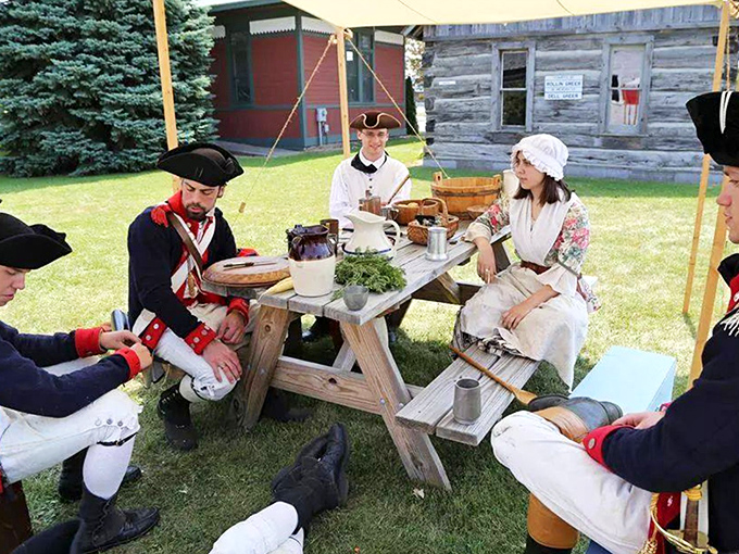Historical reenactors bring the past vividly to life, sharing a meal and conversation as Michigan settlers would have done generations ago.
