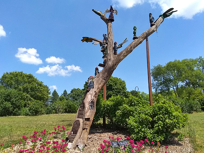 This tree-turned-stairway features tiny climbers on what seems like an eternal journey upward &ndash; a vertical storytelling masterpiece.