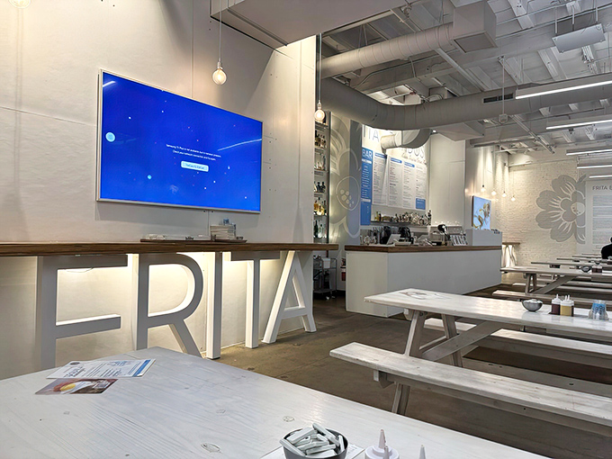 Minimalist industrial-chic meets warm hospitality, with the restaurant's story proudly displayed on white brick walls for curious diners to discover.