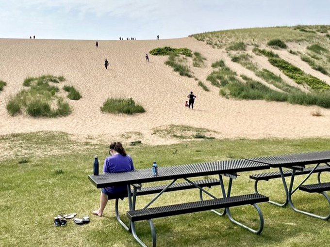 A peaceful moment before the climb, where picnic tables offer a place to fuel up or recover from sand-induced exhaustion.