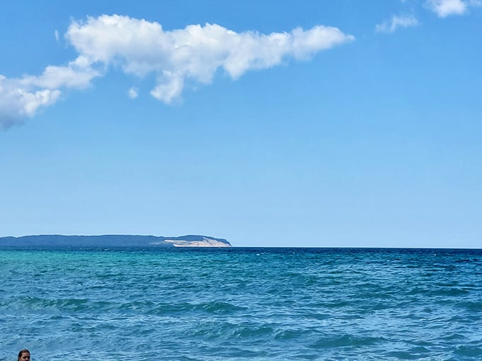 The horizon stretches endlessly, blurring the line between water and sky in a display that rivals any ocean view.