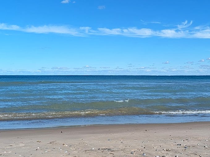 Lake Huron shows off its Caribbean-worthy blues on a cloudless day, proving Michigan's waters can rival any tropical destination.