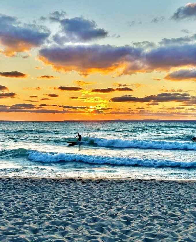 Catching waves and memories simultaneously &ndash; surfers find their bliss against a backdrop of Michigan's most spectacular sunset.