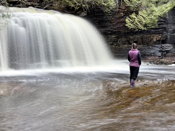 Sometimes the best view isn't from the observation deck – it's standing knee-deep in the experience, feeling the power firsthand.