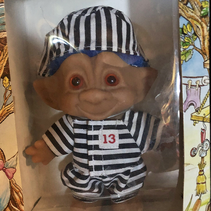 Prison stripes never looked so cute &ndash; this vintage troll doll in convict garb is oddly adorable despite its mischievous backstory.