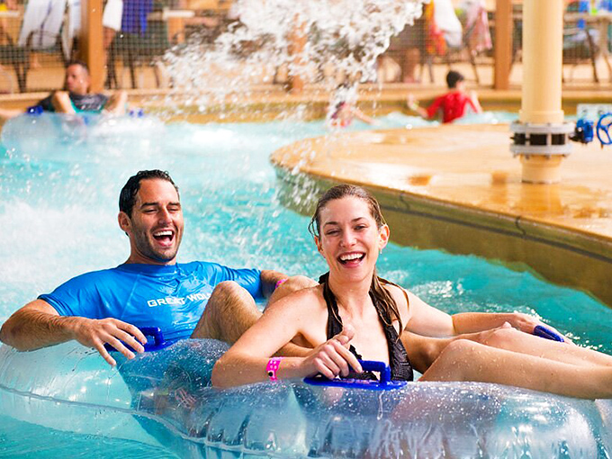 Exhilaration personified &ndash; two thrill-seekers riding the current in perfect harmony, their laughter competing with the splash of rushing water.