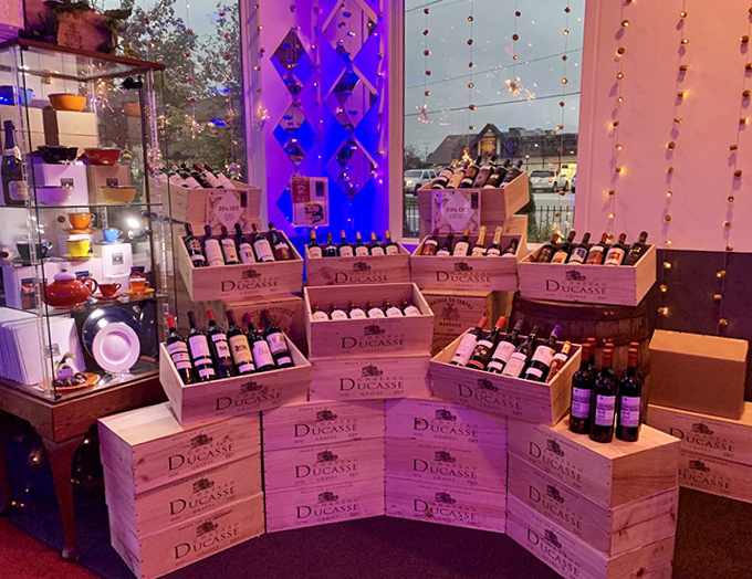 The wine display transforms bottles into an architectural feature &ndash; proving that proper storage can be both functional and beautiful, unlike your garage.